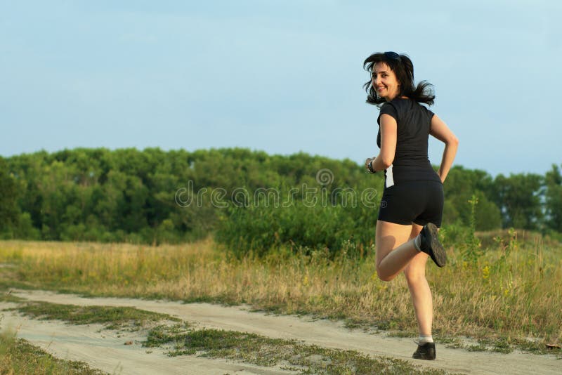 Woman Jogging Outdoors Turn Around Stock Image - Image of woman ...