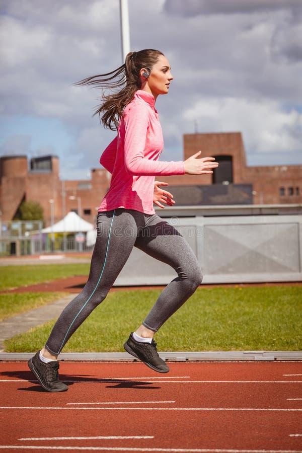 Woman Jogging on a Race Track Stock Image - Image of beautiful, person ...