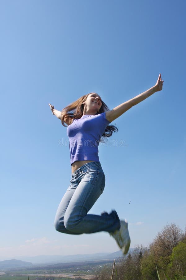 Jumping girl stock photo. Image of clouds, happiness, jumping - 1258314