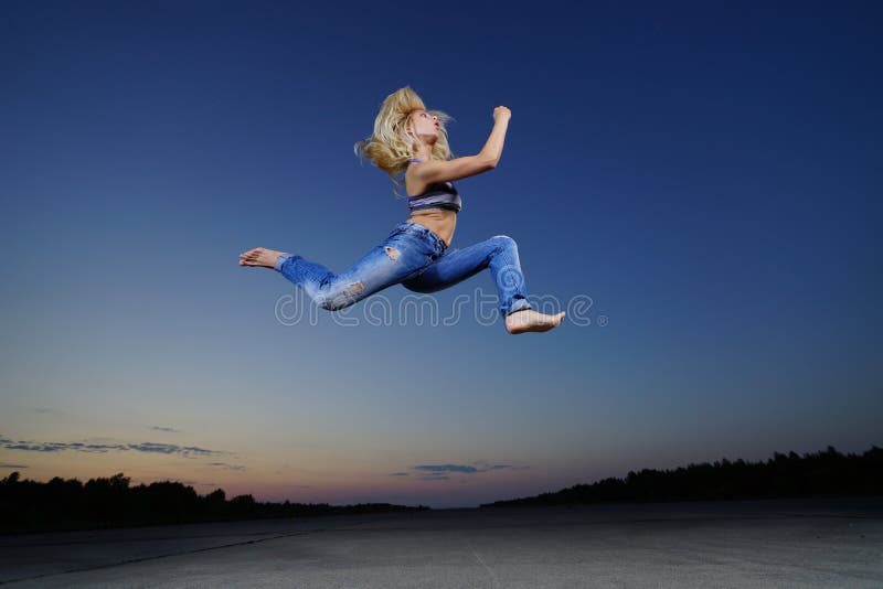 Woman jump at night stock image. Image of evening, energy - 38694603