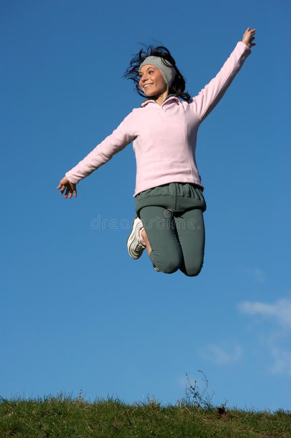 Woman jump outdoors stock image. Image of legs, cute, green - 7240803