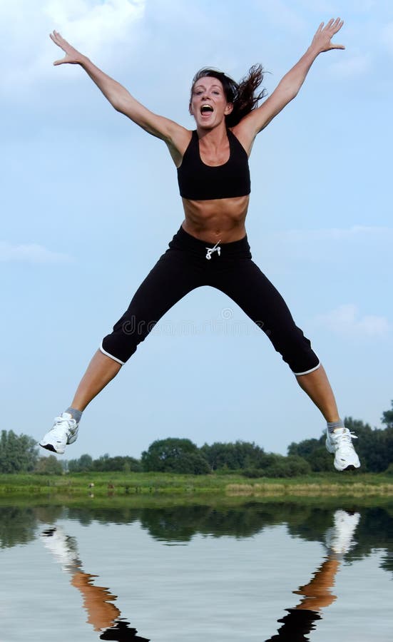 Woman jumping stock image. Image of motion, vacation, people - 1124179