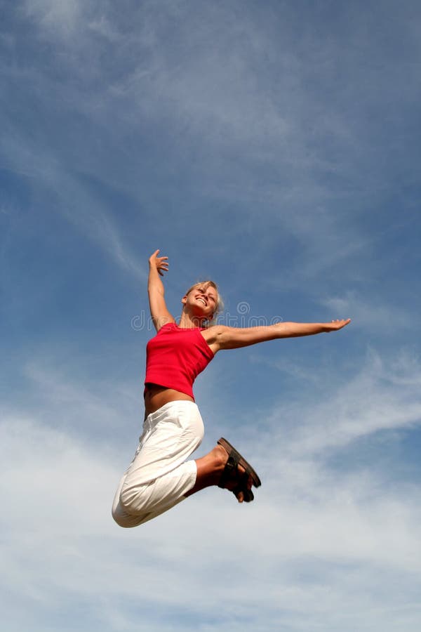 Woman Jumping Against Blue Sky Stock Image - Image of jump, action: 1026561