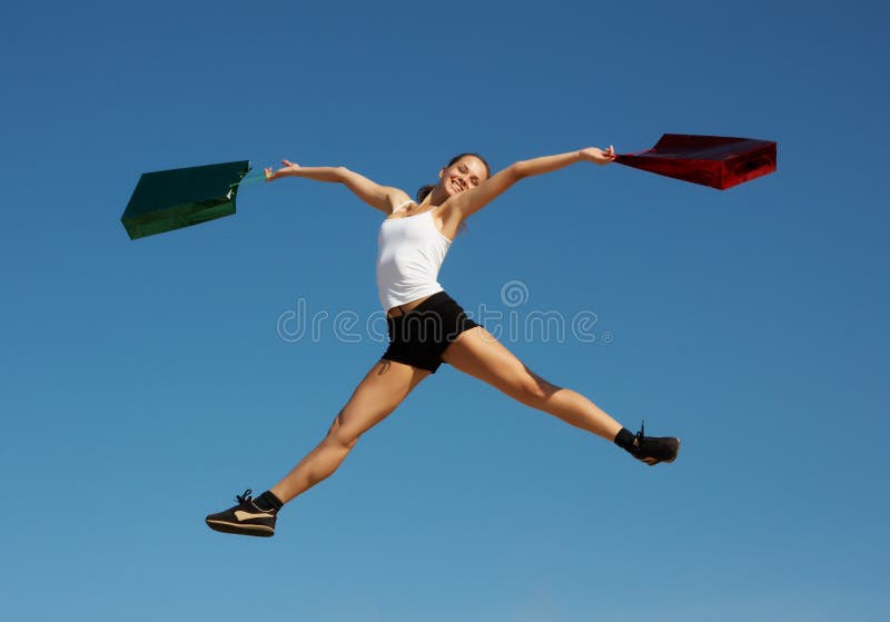 Woman jumping with bags stock photo. Image of woman, high - 6356602