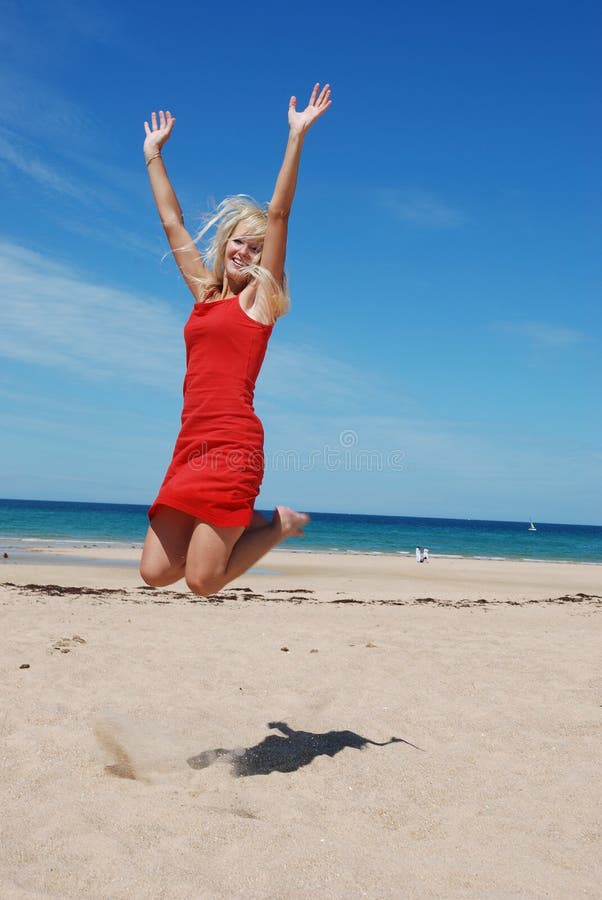 Woman Jumping on beach stock image. Image of hair, girl - 60062083