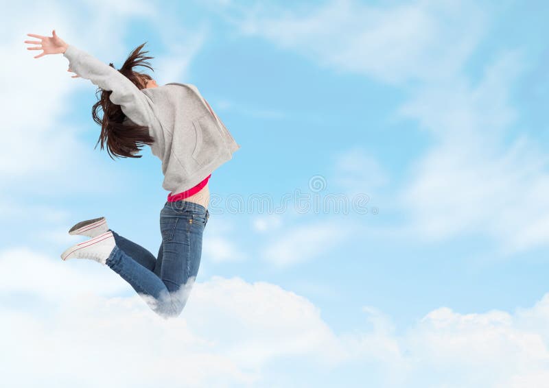 Woman Jumping Ecstatic in Cloudy Sky Stock Image - Image of brunette ...