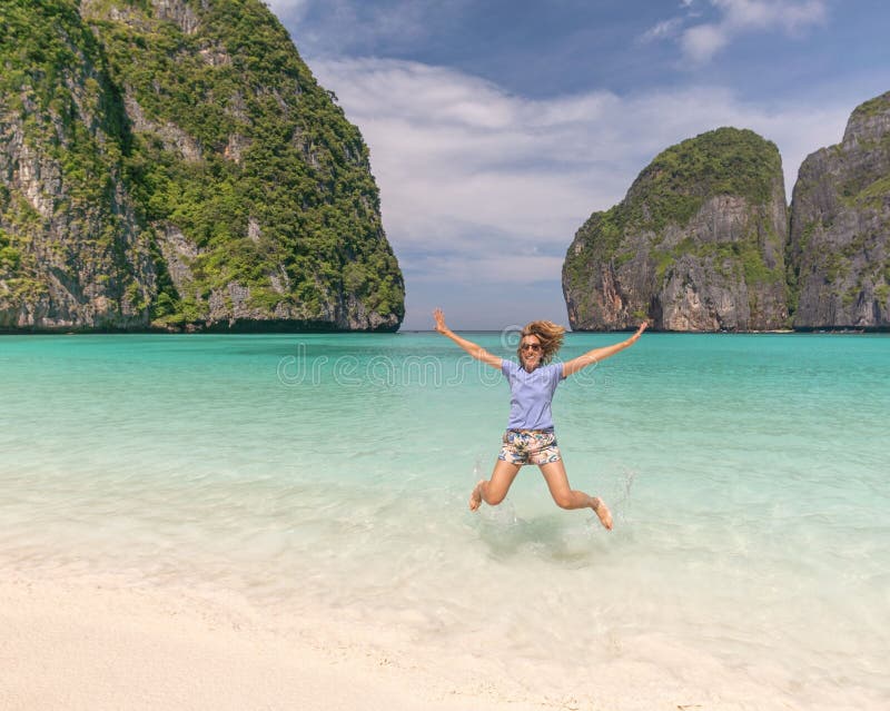 Woman Jumping for Joy on the Lonely Beach of Maya Bay Stock Image ...