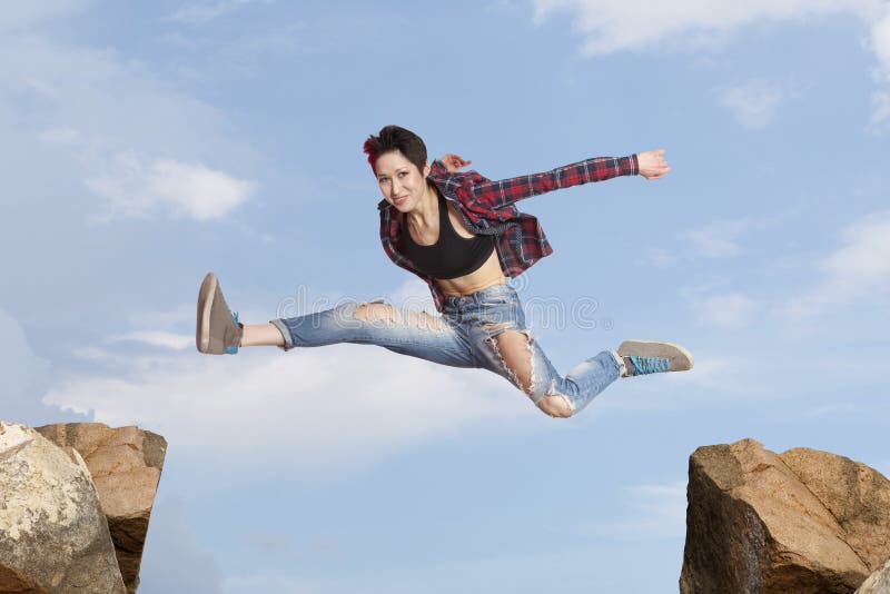 Woman Jumping Over the Gap at Blue Sky Stock Image - Image of lifestyle ...