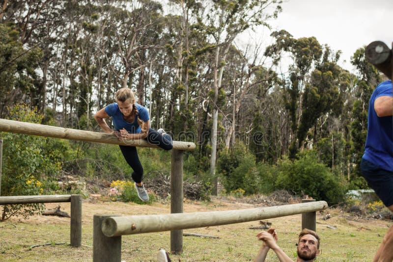 Woman Jumping Over the Hurdles during Obstacle Course Stock Photo ...