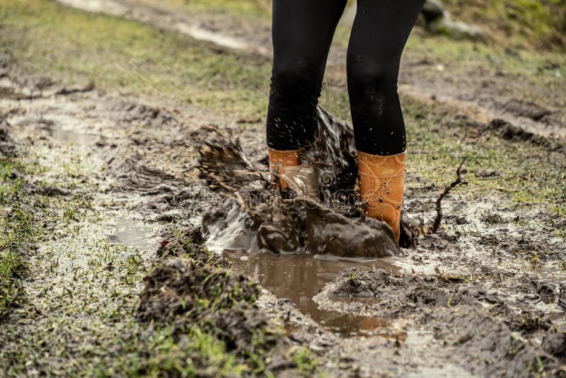 Child Jumping In Mud Puddle Stock Image - Image of environment, healthy ...