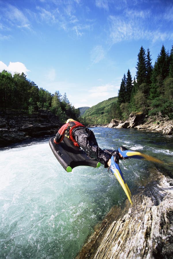 Woman jumping into river stock photo. Image of extreme - 6076988