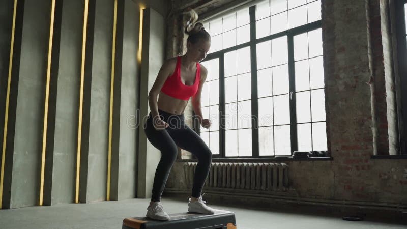 Woman Jumping on Step Platform Slow Motion. Female Legs Active Workout ...