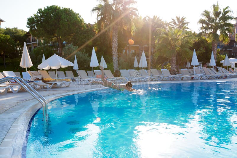 Woman Jumping in Swimming Pool Stock Image - Image of jumping, sport ...