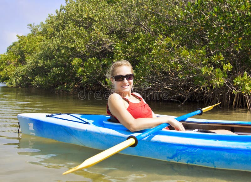 Woman Kayaking stock image. Image of nautical, mangroves - 24764769