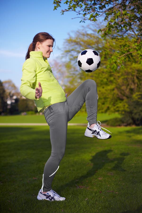 Woman Kicking Soccer Ball