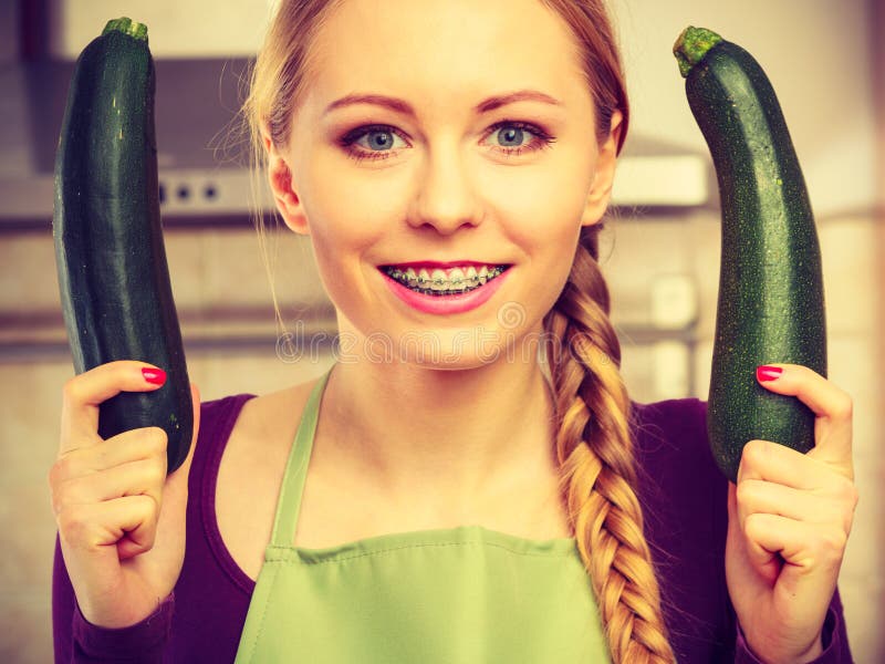 Woman In Kitchen Holds Zucchini Vegetable Stock Image Image Of Marrow