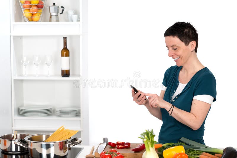 Woman in the Kitchen with Smartphone Stock Image - Image of indoors ...