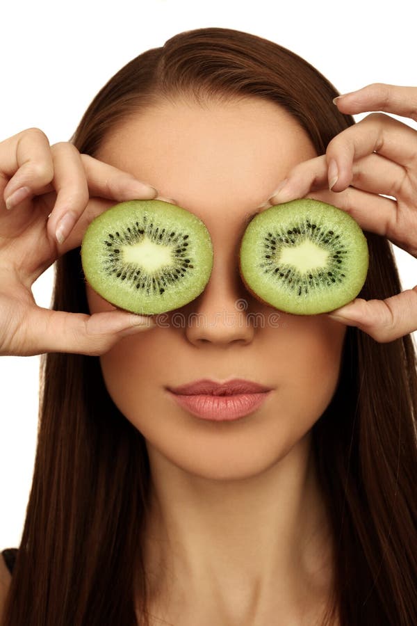 The woman with kiwi stock image. Image of health, person - 12587627
