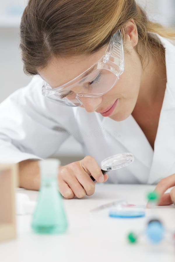 Woman in Lab Using Magnifying Glass Stock Image - Image of scientific ...