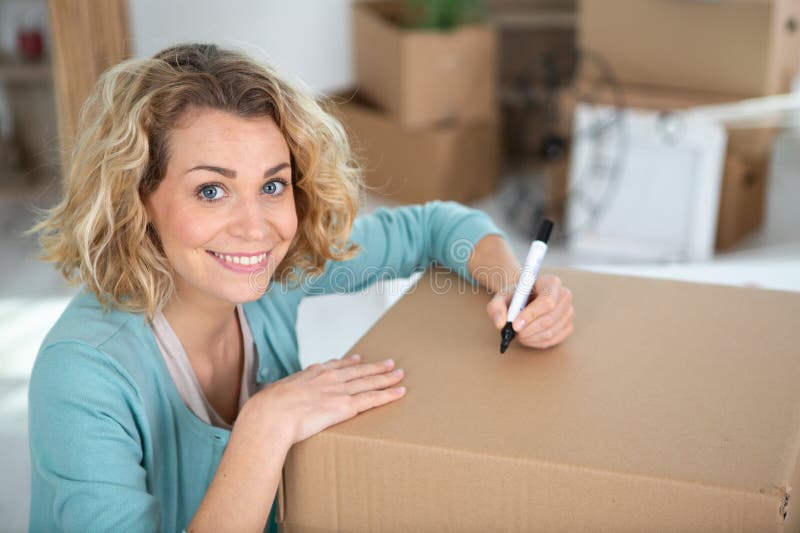 Woman Labeling Moving Box at Home Stock Image - Image of casual, moving ...