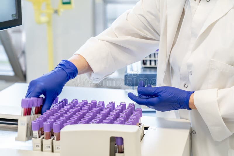 Woman in Laboratory Doing Tests for Vaccine Blood Extraction and ...