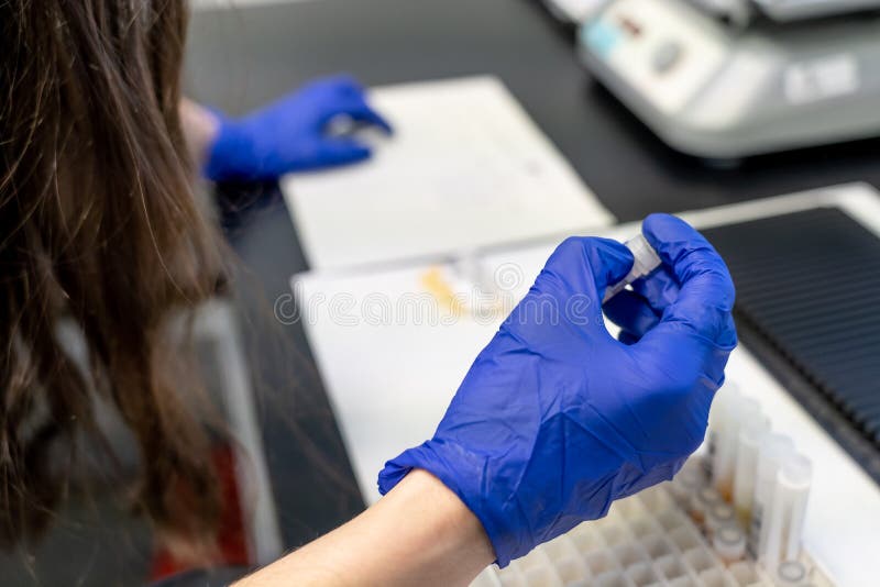 Woman in Laboratory Doing Tests for Vaccine Blood Extraction and ...