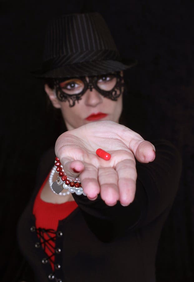 Woman in Lace Mask and Fedora Holding Red Pill Stock Photo - Image of ...