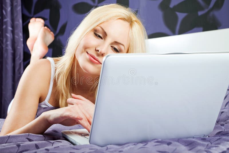 Woman laptop bed stock image. Image of comfort, woman - 14373669
