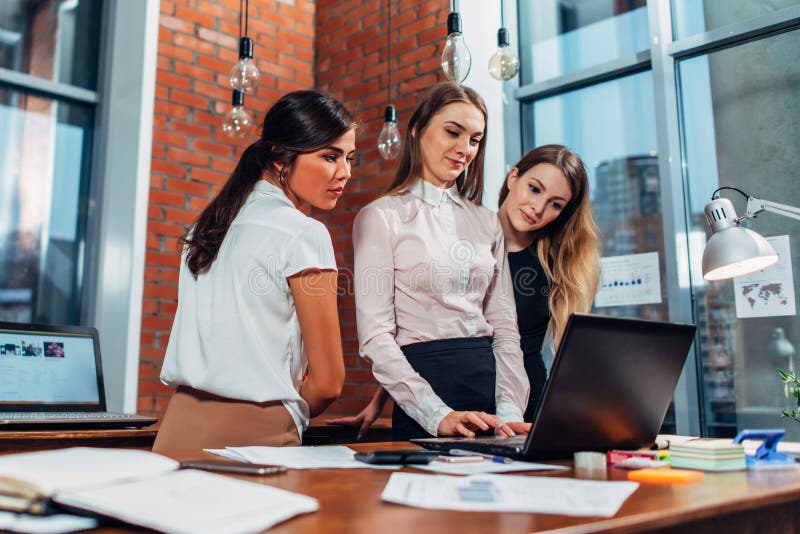 Woman with Laptop Colleagues Standing in Office Stock Photo - Image of ...