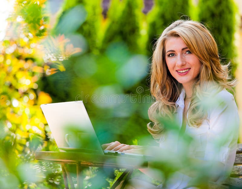 Woman with Laptop Computer in the Garden Stock Photo - Image of people ...