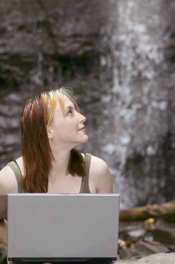 Woman with laptop at falls stock image. Image of outdoors - 5308563
