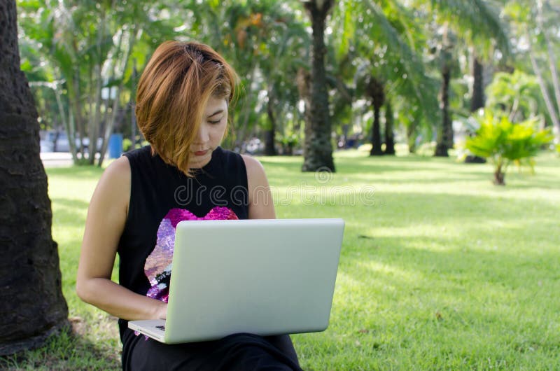 Woman laptop garden stock image. Image of internet, outside - 62661575