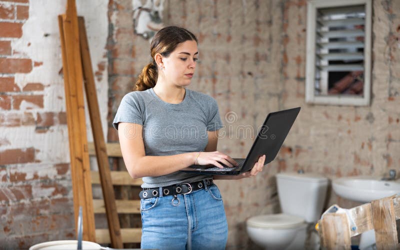 Woman with Laptop on Indoor Construction Site Stock Photo - Image of ...