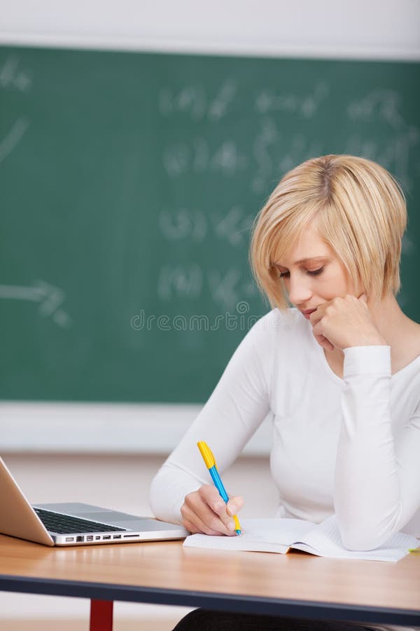 Woman with Laptop Writing Notes at Desk Stock Image - Image of indoors ...