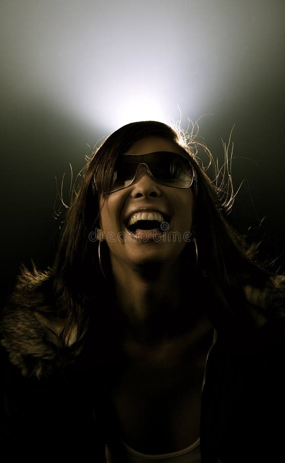 Woman Laughs in Front of Light Stock Image - Image of haute, heart ...