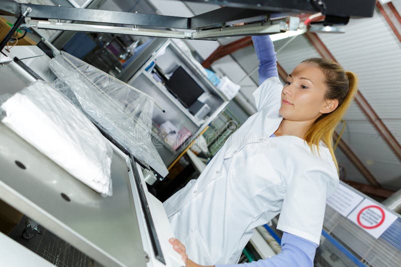 Woman Laundry Worker at Dry Cleaners Stock Photo - Image of chemical ...