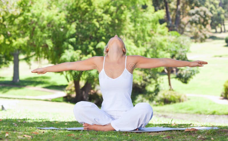 Woman on the Lawn Doing Yoga Exercises Stock Photo - Image of sunshine ...
