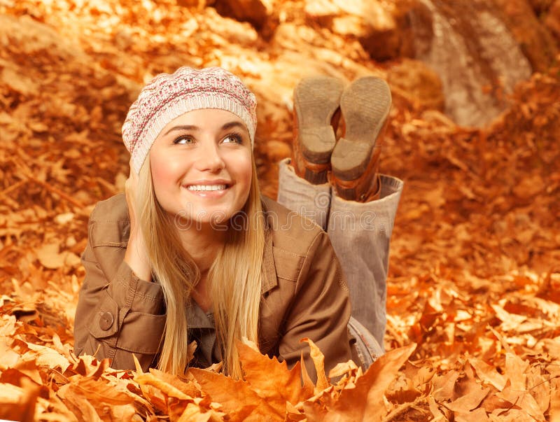 Woman Lay Down on Autumnal Foliage Stock Photo - Image of happy ...