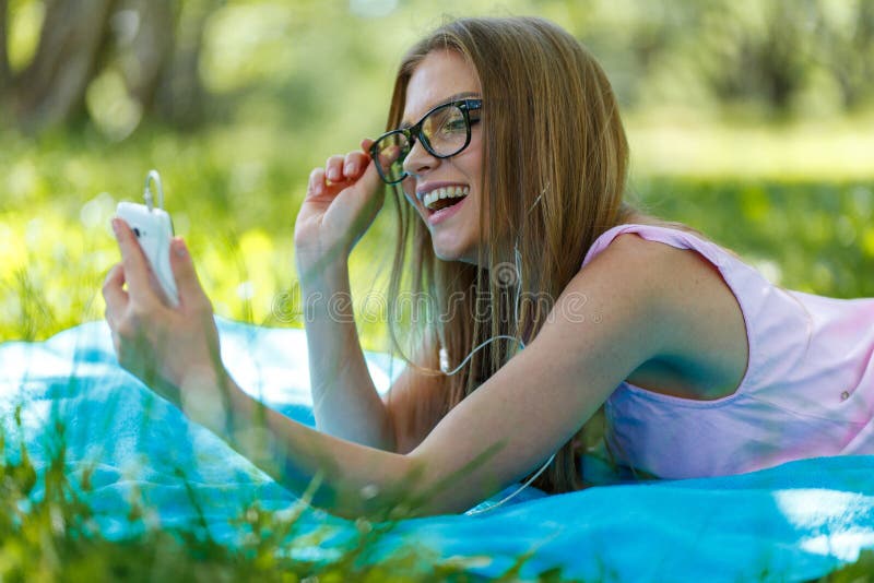 Woman Lay Down or Relaxing on Green Grass Reading Book in Summer or ... Woman Lay Down or Relaxing on Green Grass Reading Book in Summer or ...