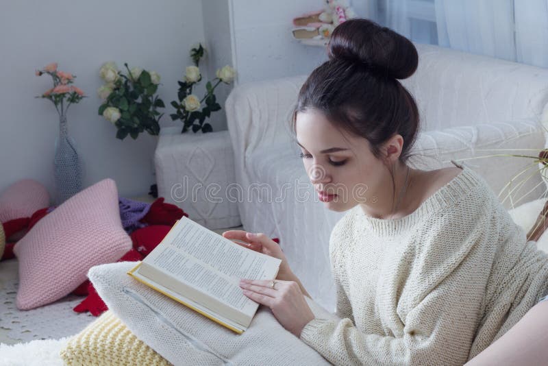 Woman Leafing through Favorite Book Stock Photo - Image of calm, house ...