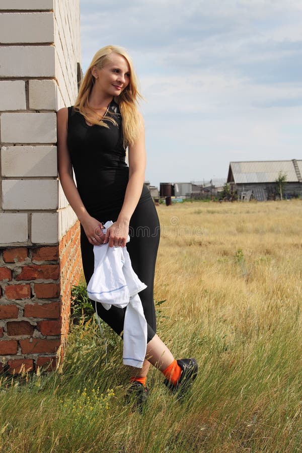 Woman Lean on House Brick Wall. Stock Photo - Image of daytime, wall ...