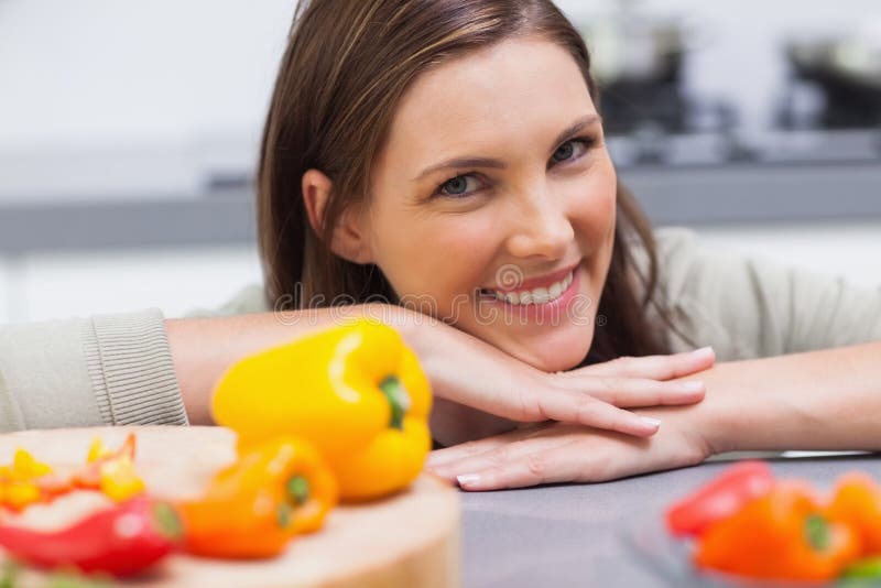Woman Leaning on the Counter of Her Kitchen Stock Photo - Image of ...