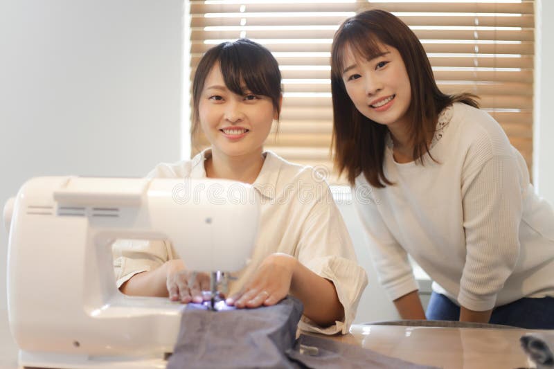 A Woman Learning How To Use a Sewing Machine Stock Image - Image of ...