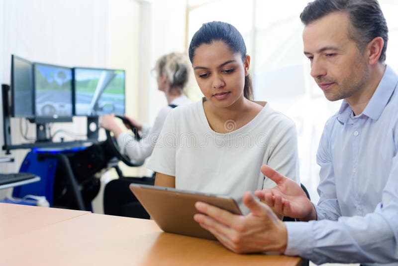 Woman Learning To Drive with Tablet Stock Photo - Image of notebook ...