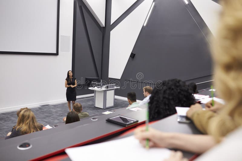 Woman Lecturing Students in a Lecture Theatre, Mid Row POV Stock Image ...