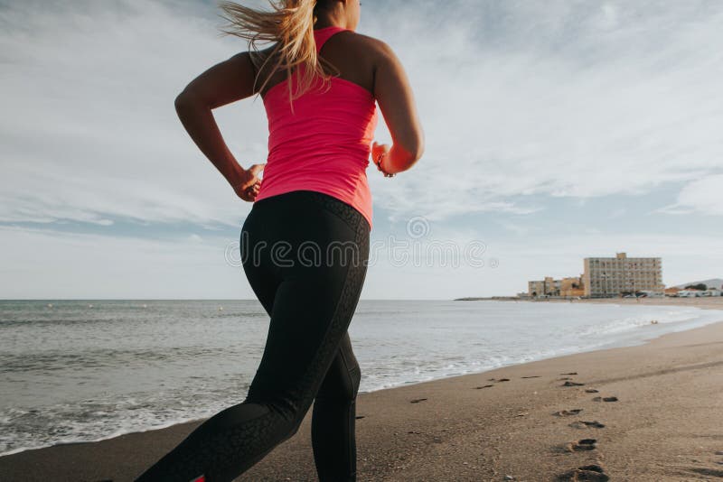 Woman Leg Stretching at the Beach. Stock Image - Image of orange ...