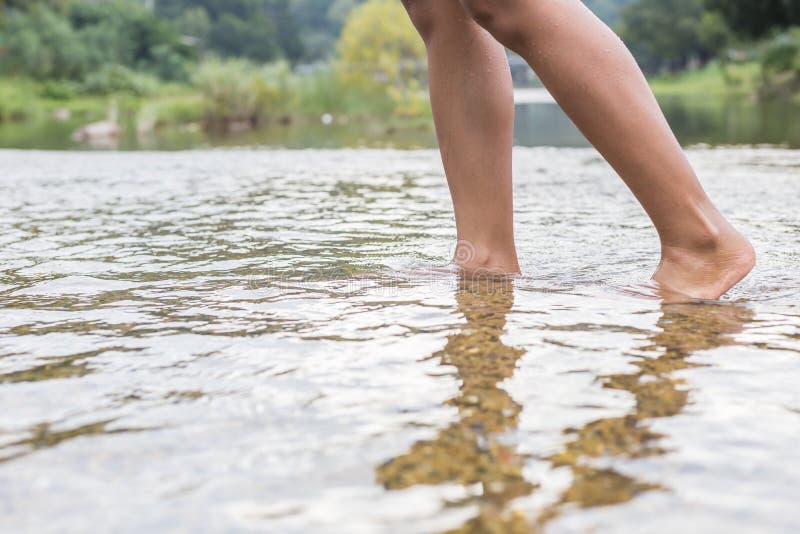 Woman Legs while Standing the River. Focus on Right Leg Stock Photo ...