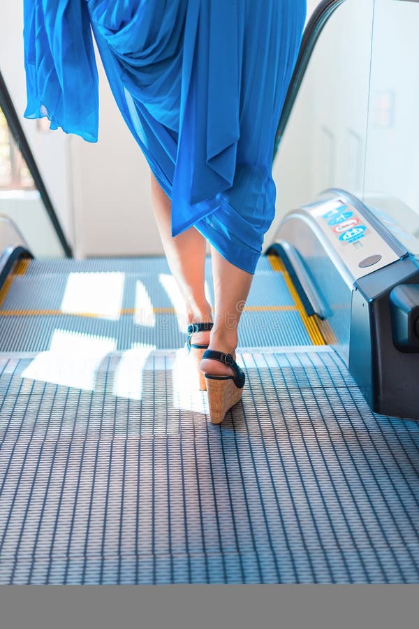 Woman Legs Stepping on an Escalator Stock Image - Image of feet, step ...