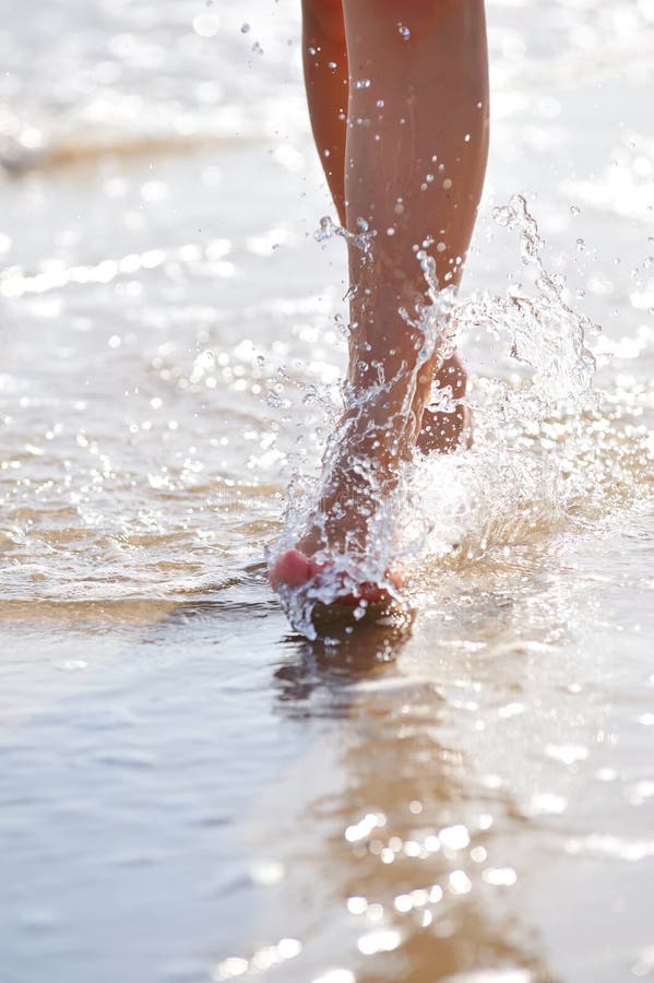 Running through waves stock photo. Image of sport, color - 592174