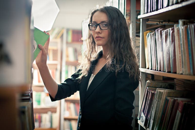 Woman at library stock image. Image of books, bookshelves - 26056085